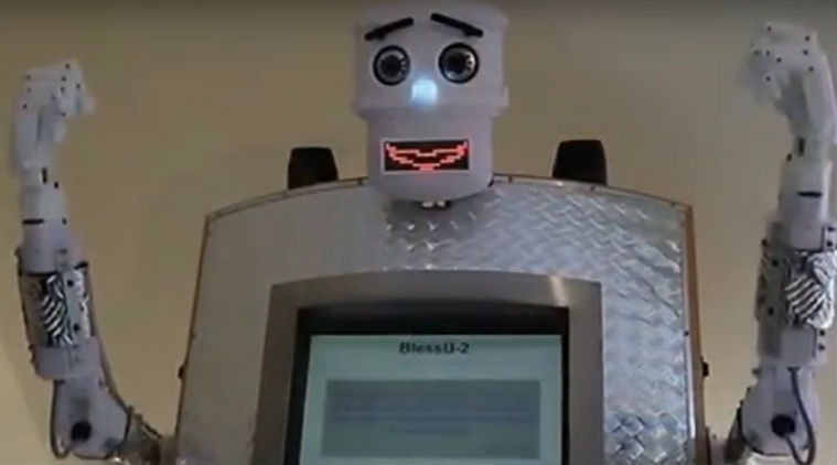 This robot priest delivers automated blessings at a German church ...