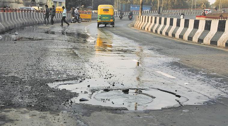 Delhi: Potholes, waterlogging dot Rani Jhansi flyover | Delhi News ...