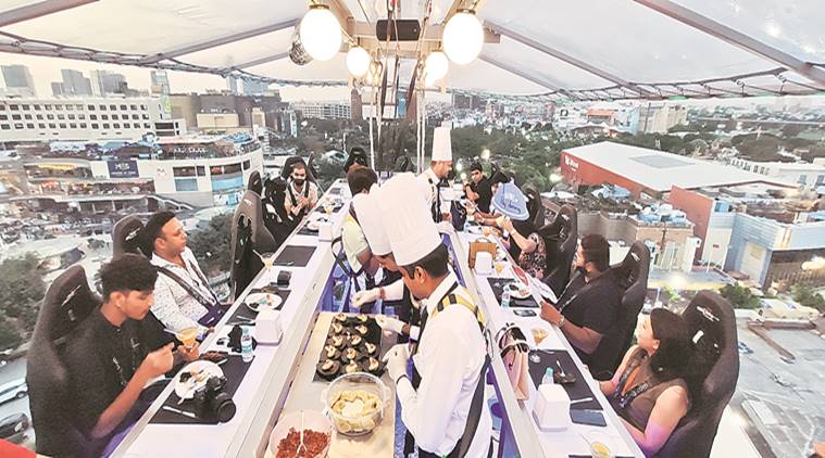 A restaurant suspended from a crane, 160 feet above the ground ...