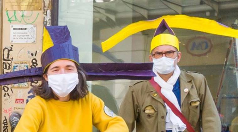 A Parisian gallery is using winged hats to maintain social distancing ...